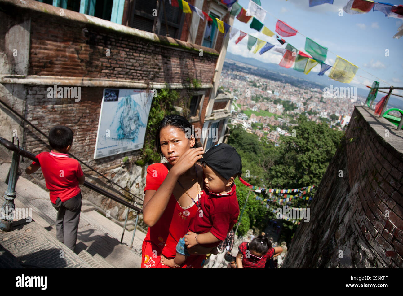 A mother comes up the steps to the Monkey Temple Stock Photo - Alamy