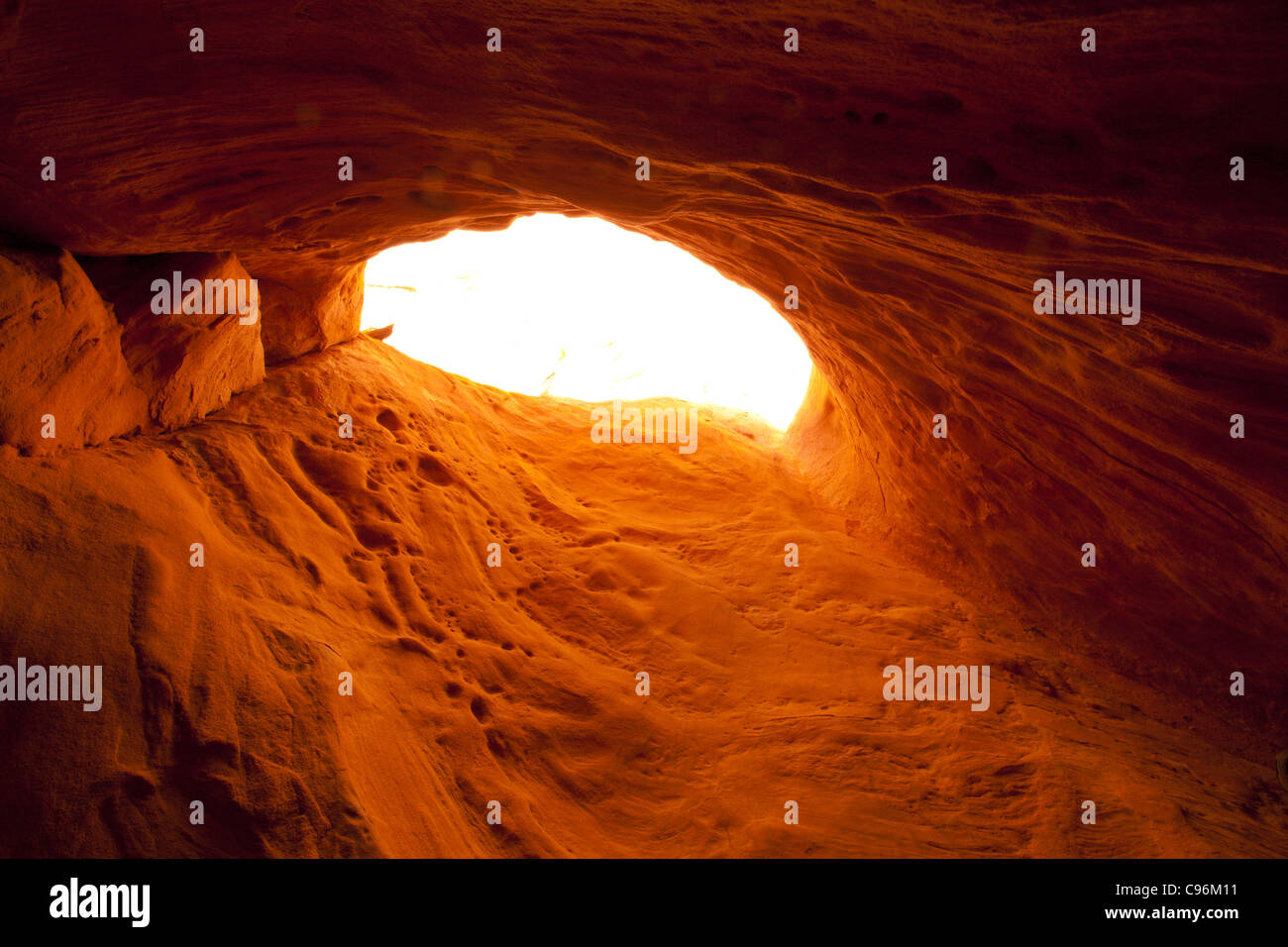 A tunnel in red rock Stock Photo - Alamy
