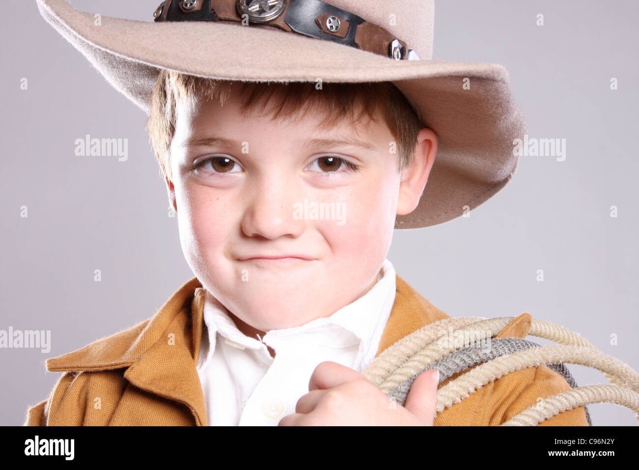 A headshot of a young cowboy Stock Photo - Alamy
