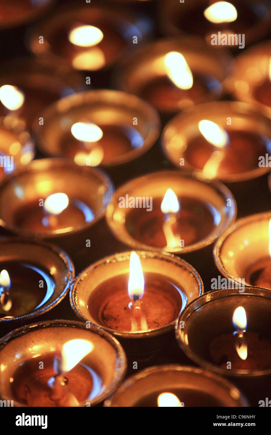 butter or oil lamps for Buddhist rituals Stock Photo - Alamy