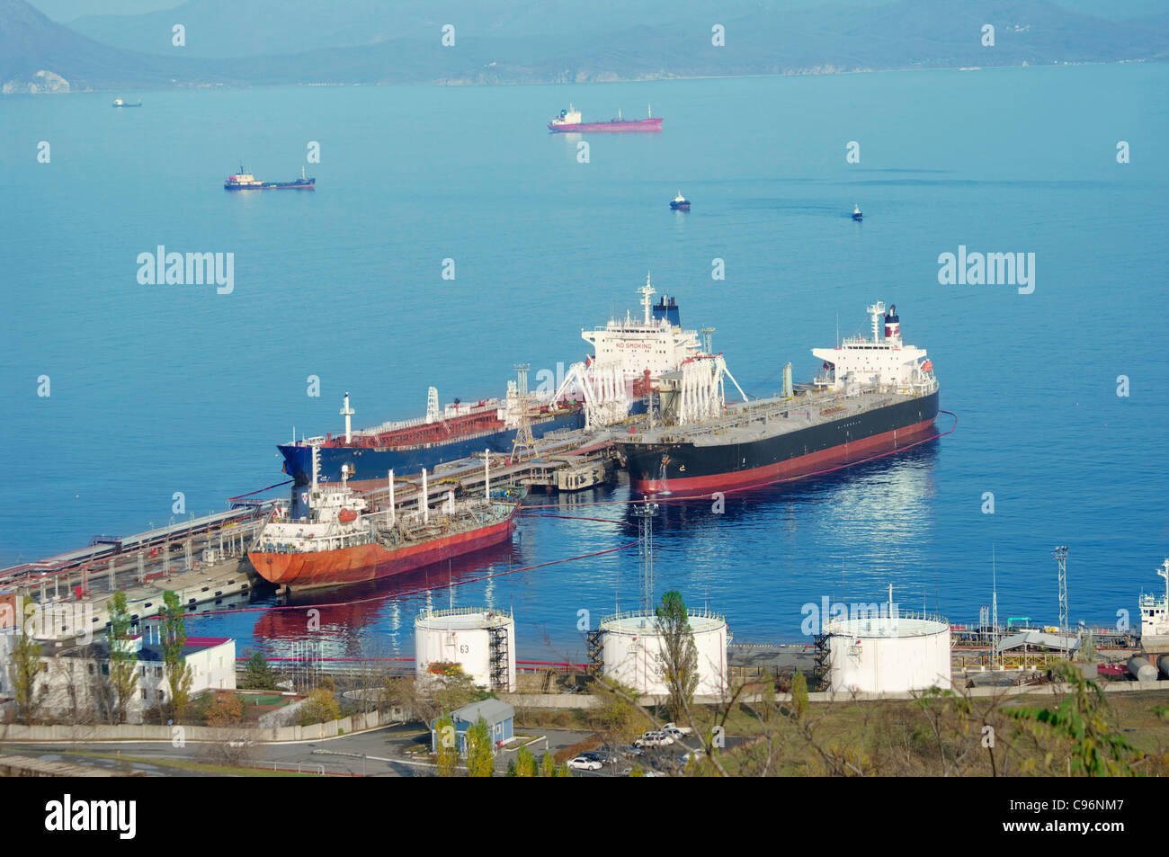 tankers standing under load in the oil port Stock Photo - Alamy