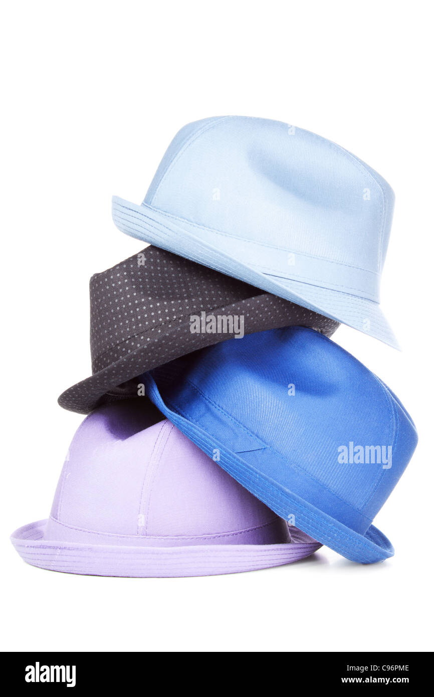 Colorful stack of modern hats. Isolated over white background Stock ...