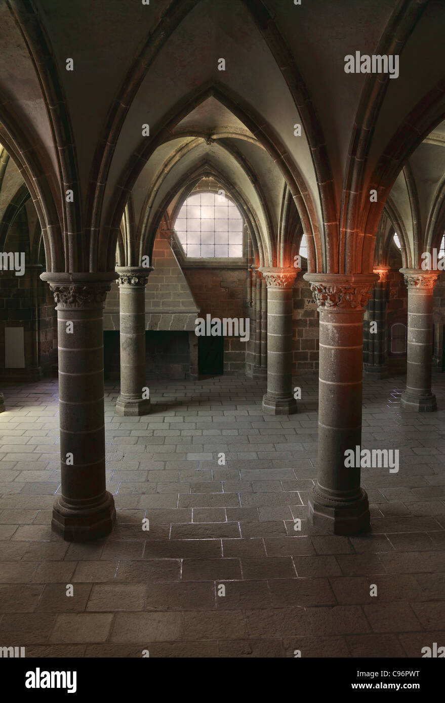 Gothic columns and arches inside the monastery from Mount St Michel ...