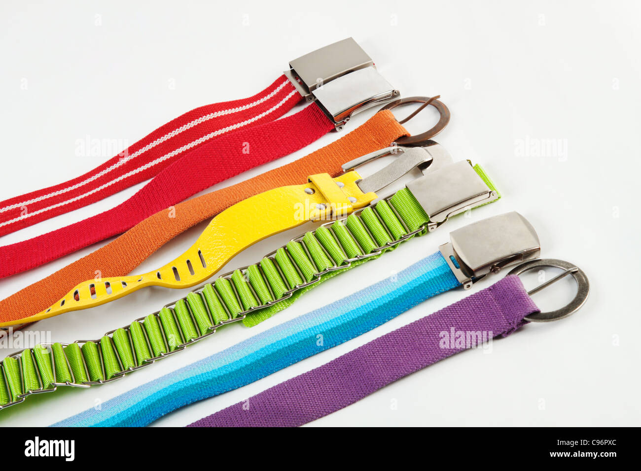 Seven textile belts with metal buckles over the bright background Stock ...