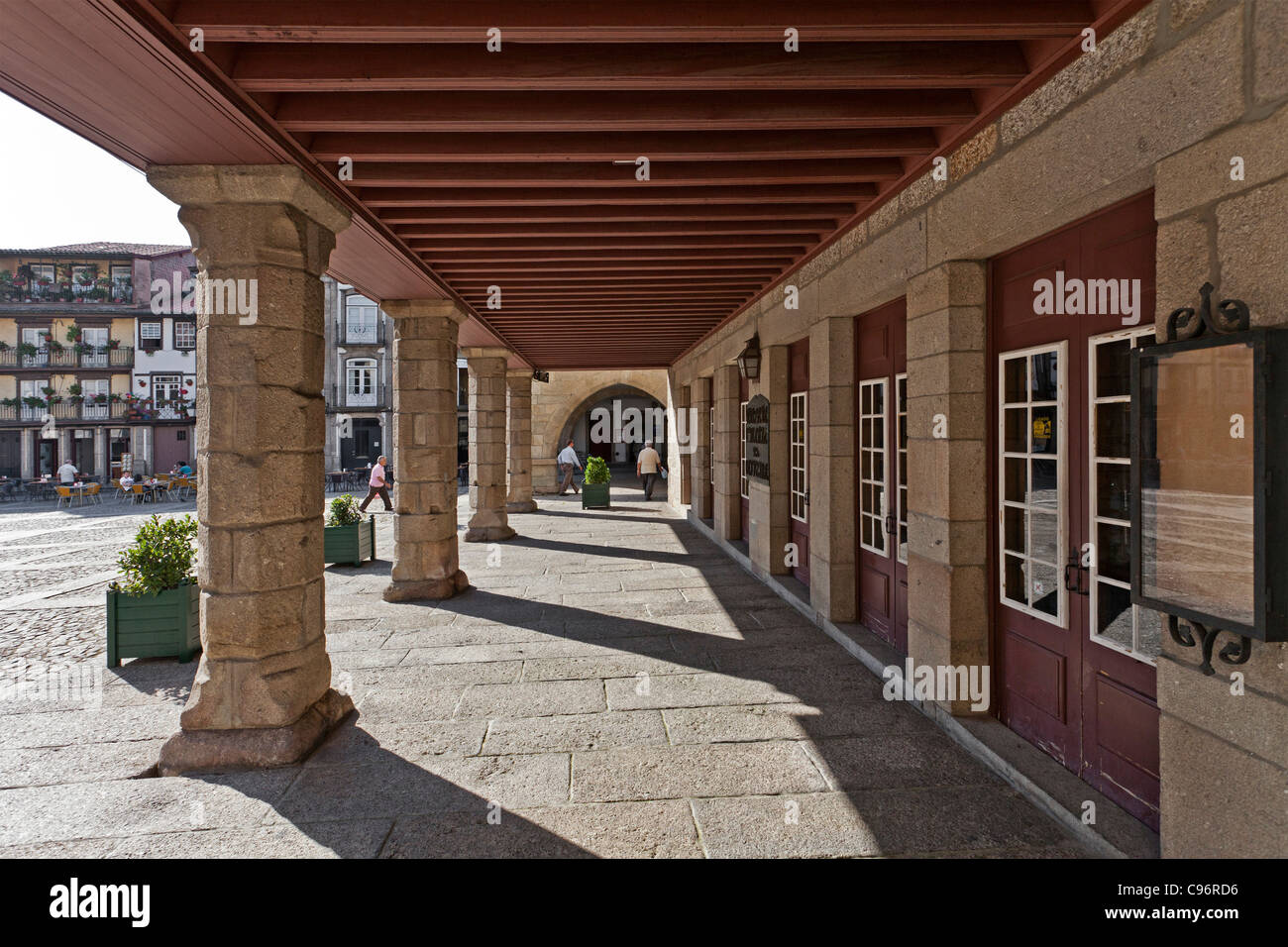 Medieval building colonnade and Oliveira Square, Guimares, Portugal ...