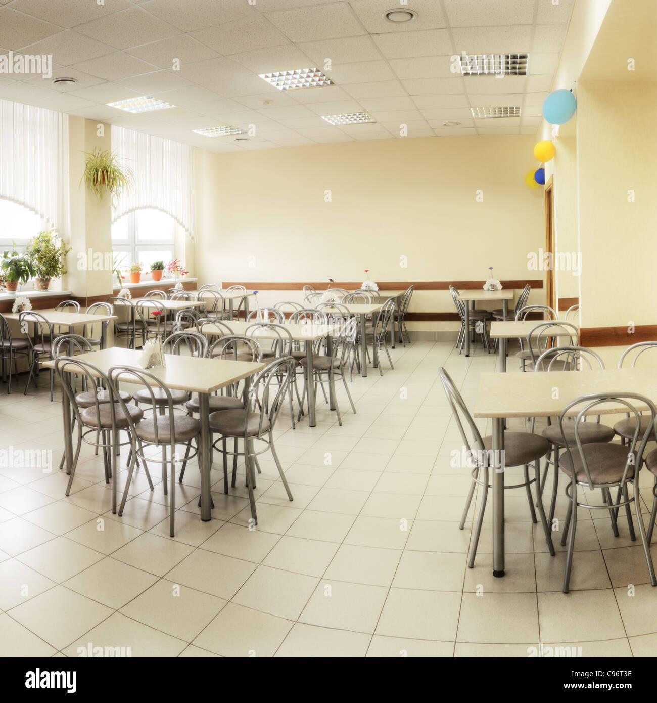 Empty cafe hall with green plants and some colorful balloons Stock ...