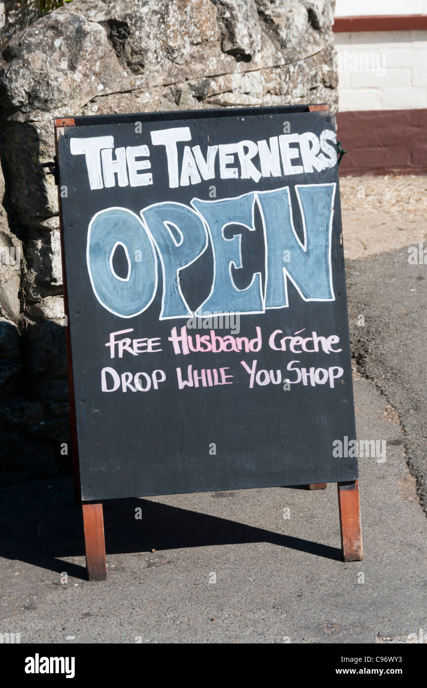 A sign for a Husband Creche, outside a pub Stock Photo - Alamy