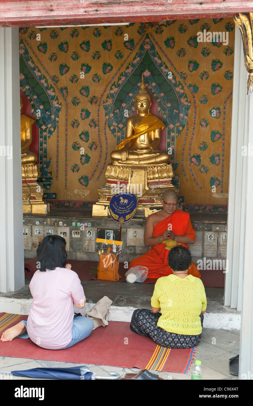 Thai people praying at the temple with a monk, Bangkok, Thailand Stock ...