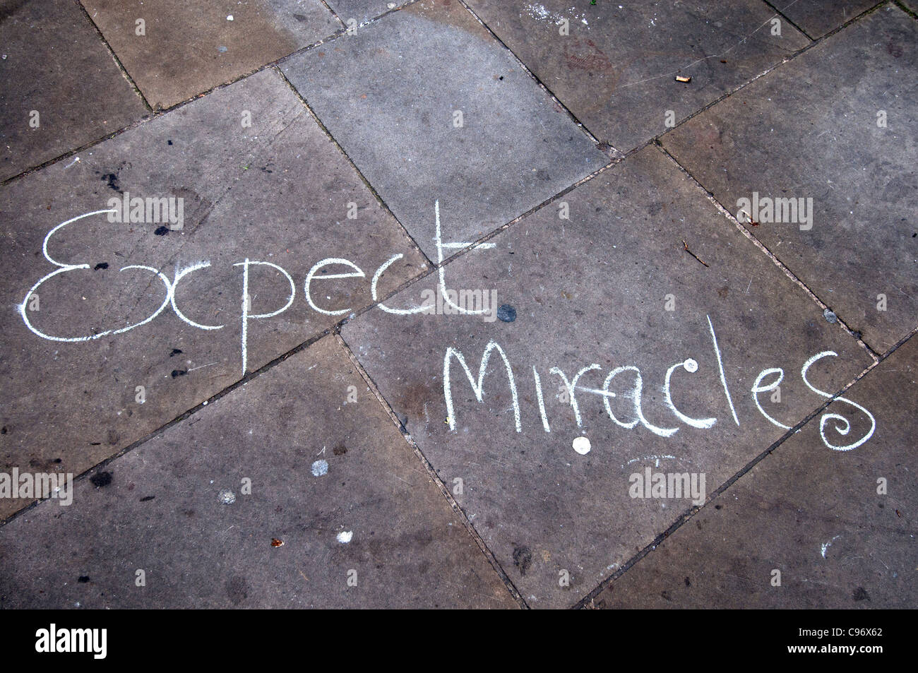 November 12th 2011Occupy London camp at St Paul's. Writing on paving ...