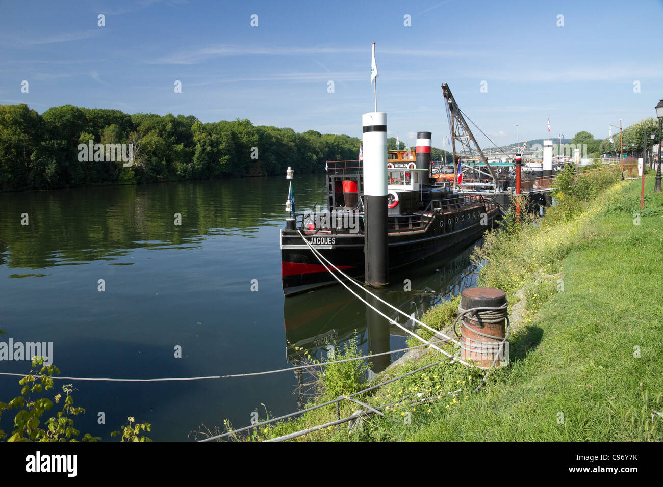 Barge house-boat moored along river close to village of Herblay France ...