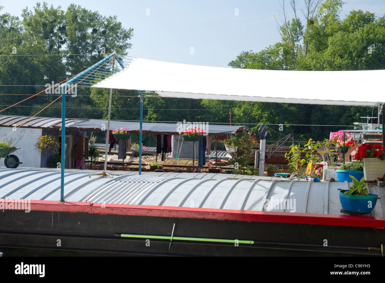 Barge house-boat moored along river close to village of Herblay France ...