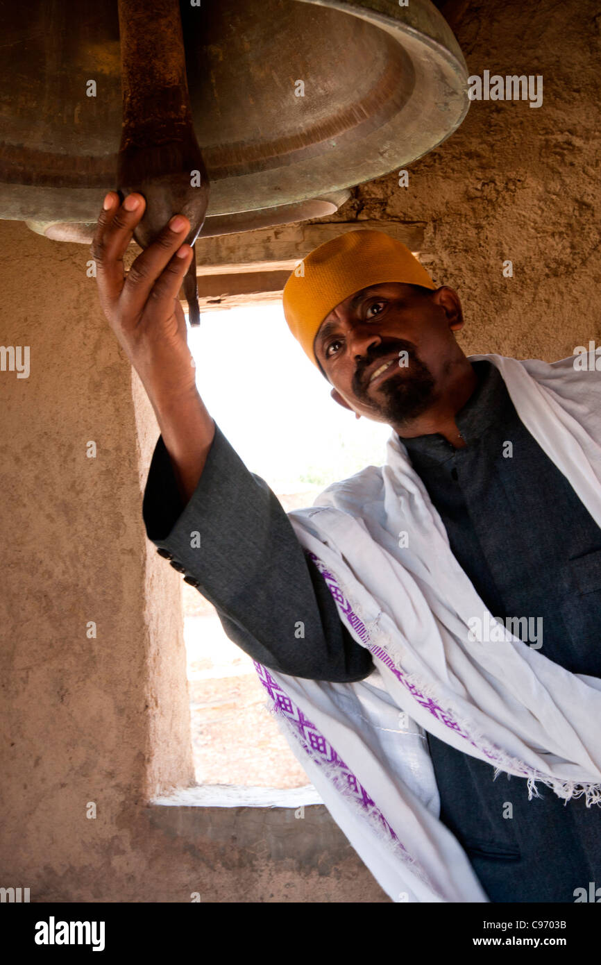 An Orthodox Christian priest in the bell-tower at the cliff-top ...