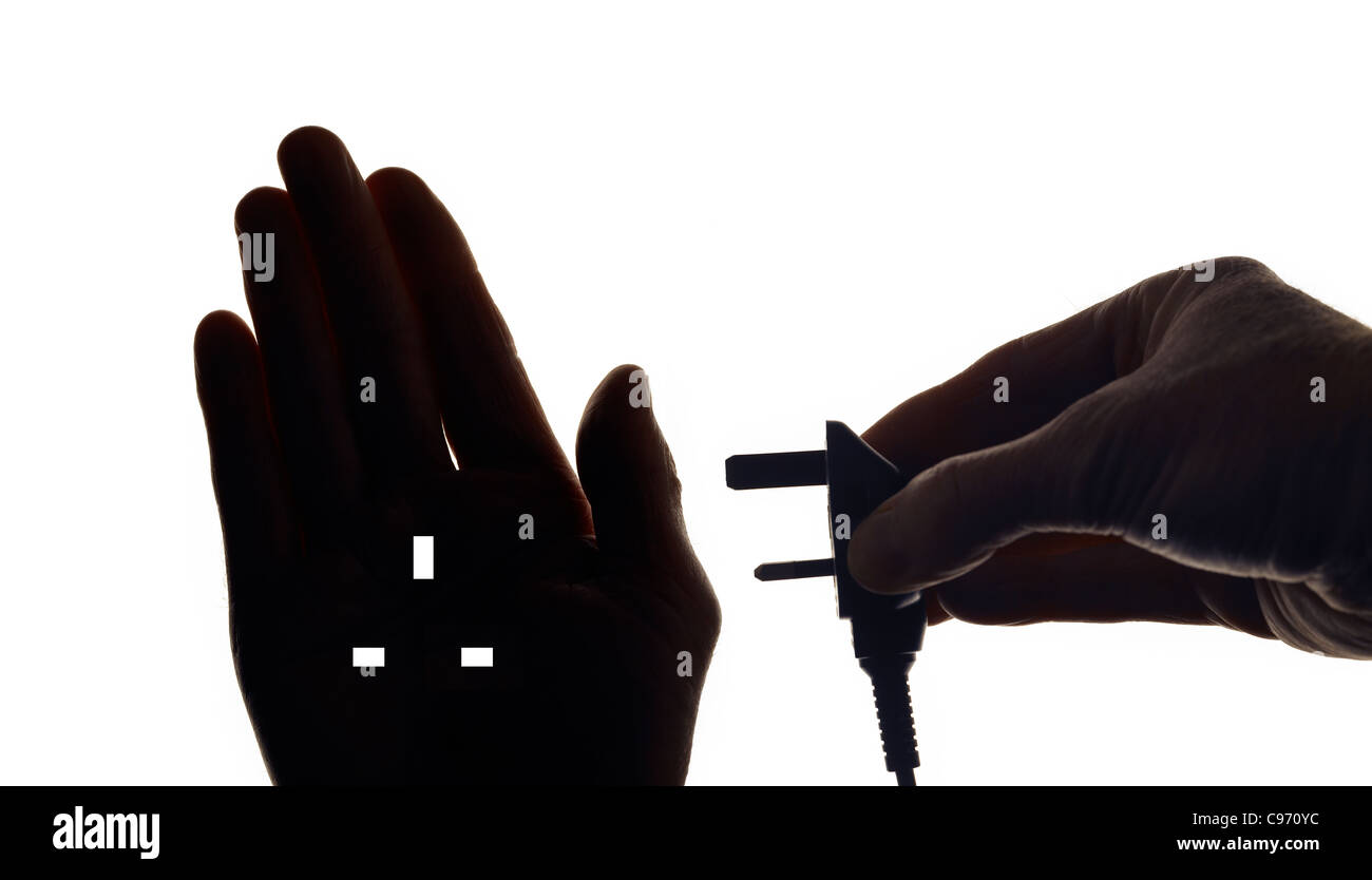 Hand holding 3 pin power plug and hand with socket holes Stock Photo ...