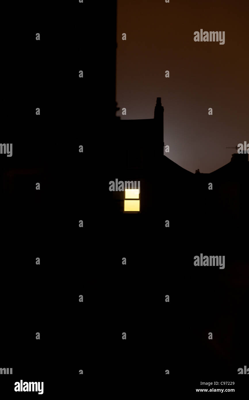 a view over rooftops at dusk Stock Photo - Alamy