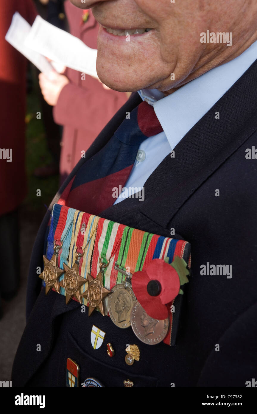 An old soldier, a WWII veteran wears his campaign war medals with pride ...