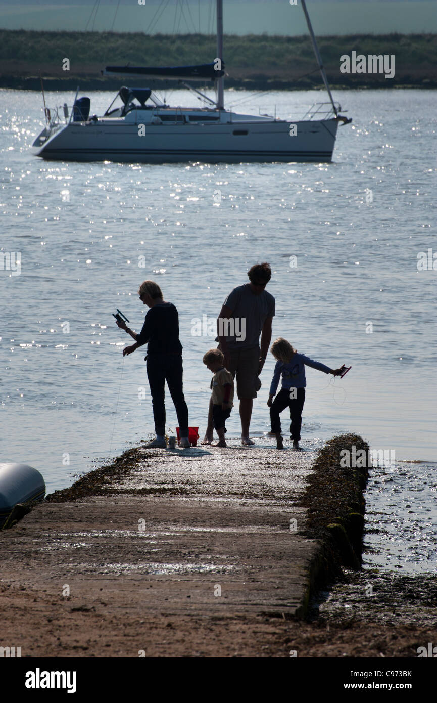 family crabbing at ramsholt river deben suffolk uk Stock Photo - Alamy