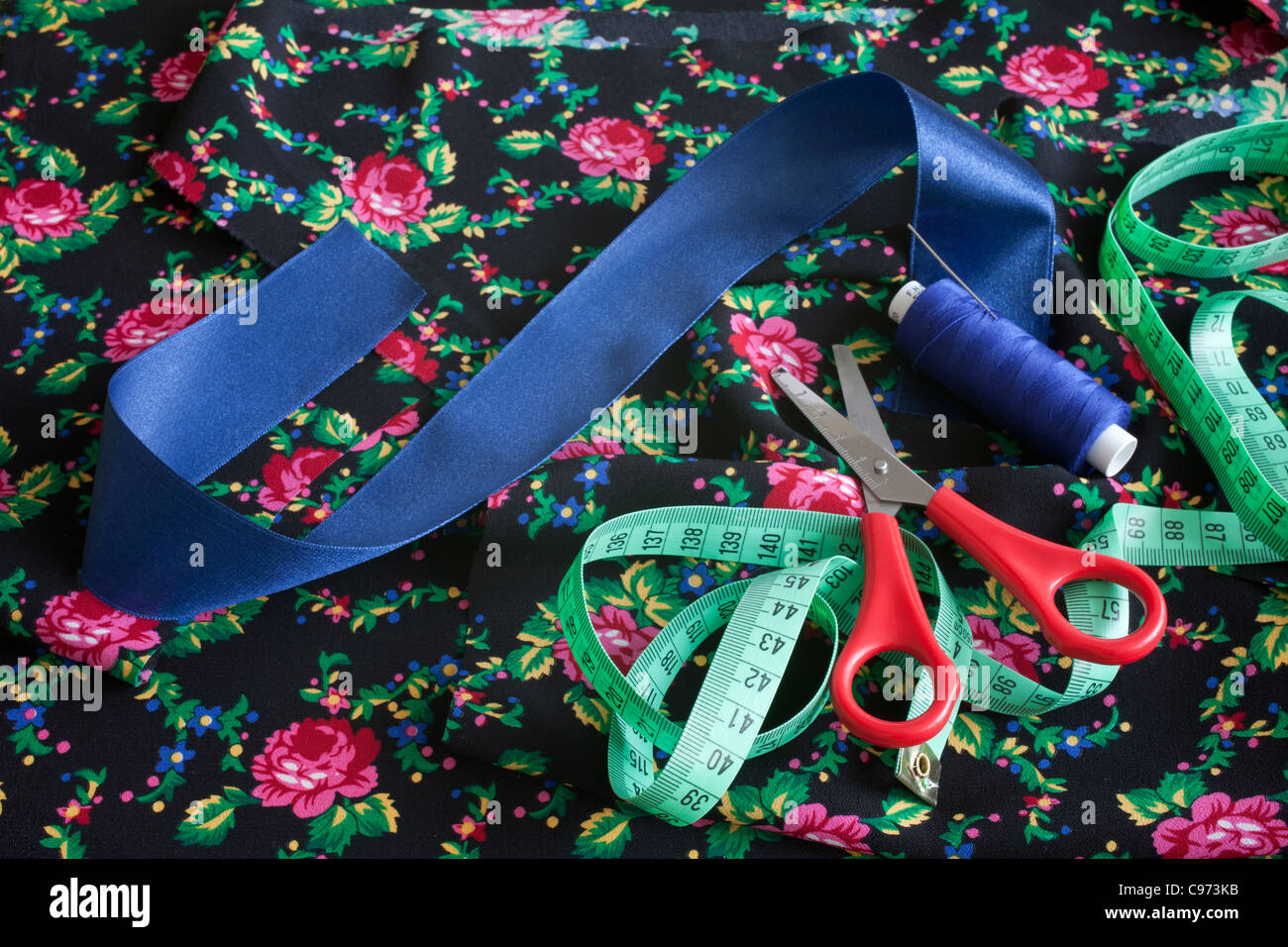 Hand sewing with a colorful material Stock Photo - Alamy