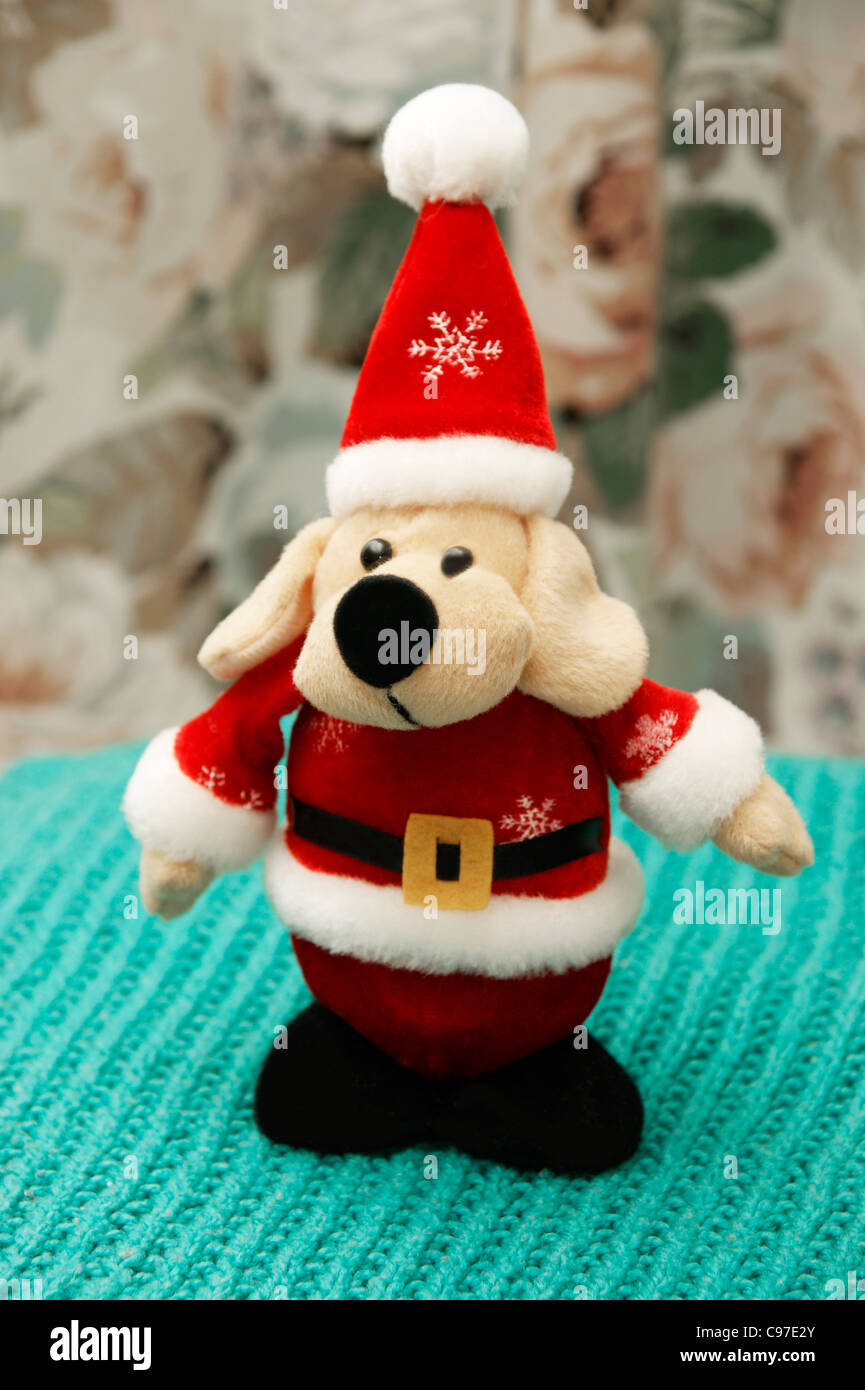 Father Christmas (Santa Clause) cuddly toy dog Stock Photo - Alamy