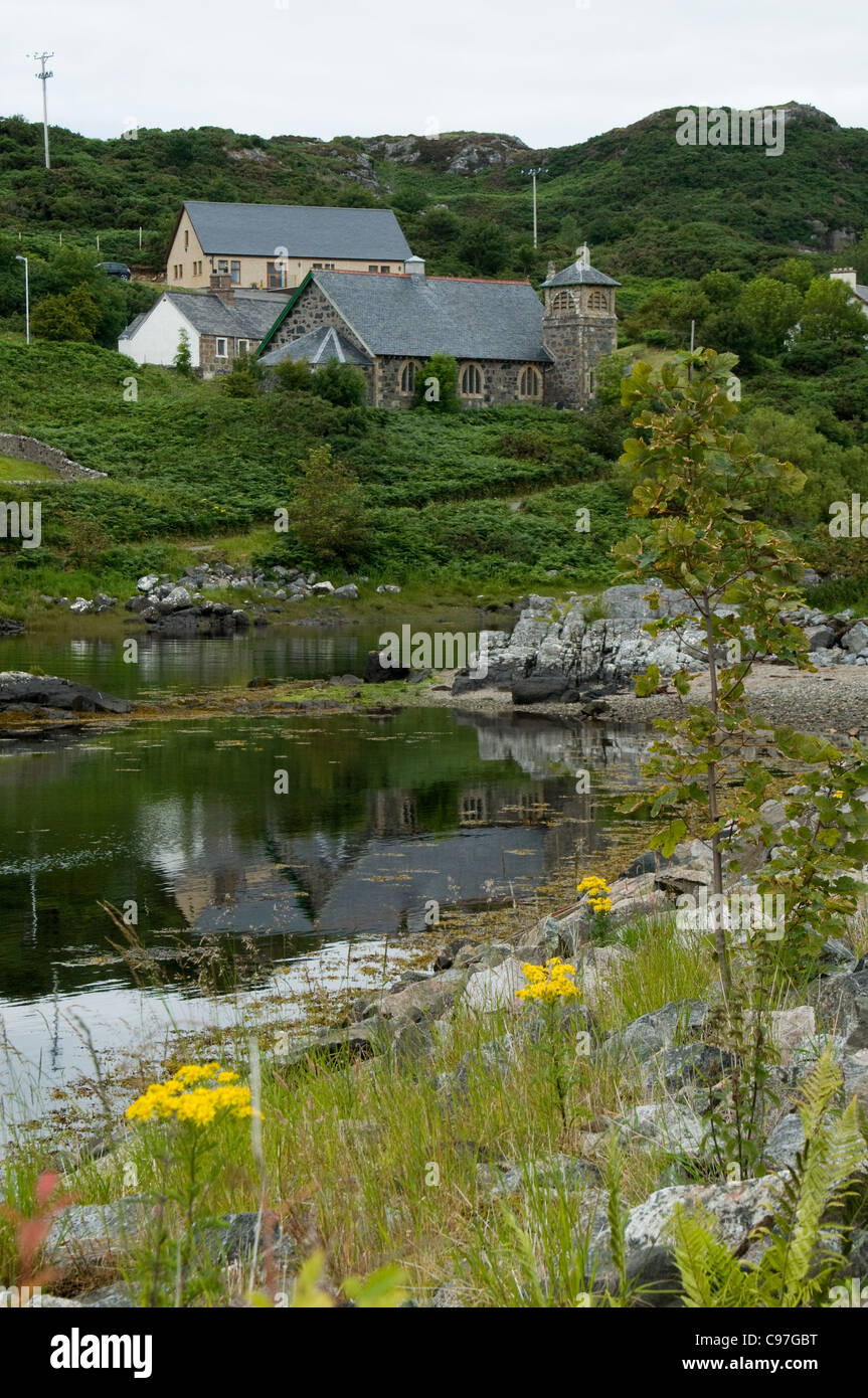The village of Lochinver sits on the banks of River Inver where it ...