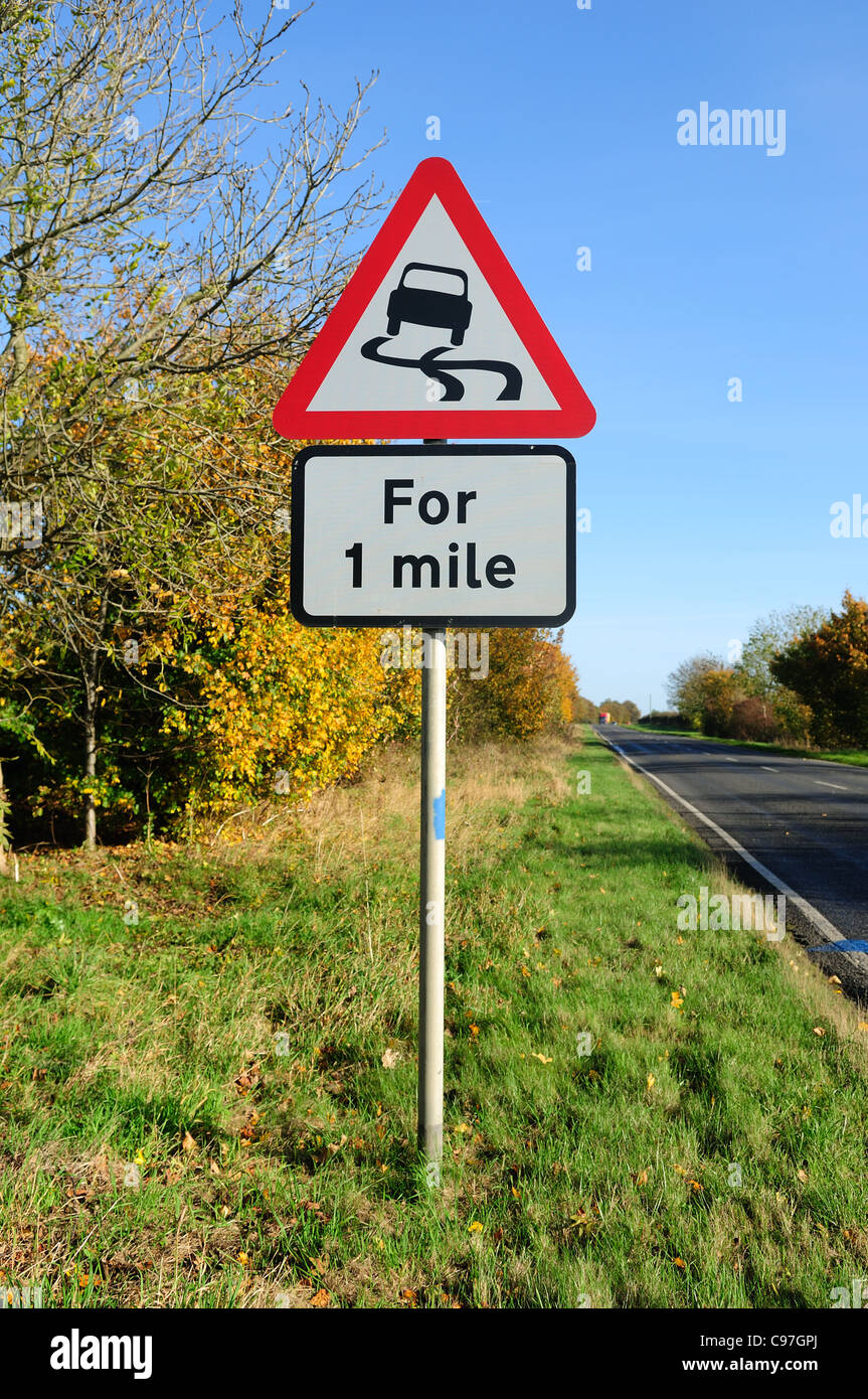 Road sign slippery road uk hi-res stock photography and images - Alamy