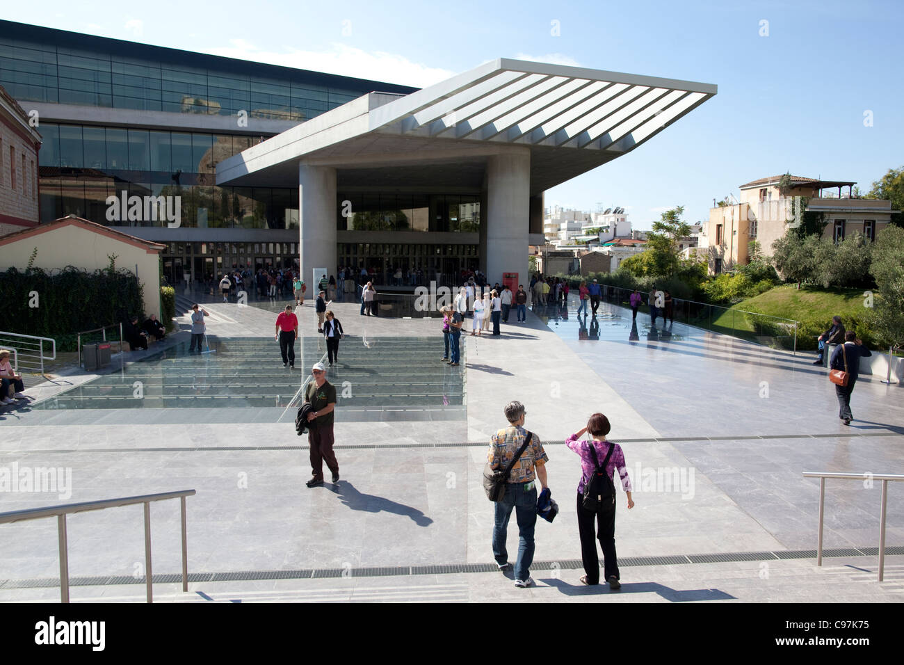 Tourists at the new Acropolis Museum, designed by architect Bernard ...
