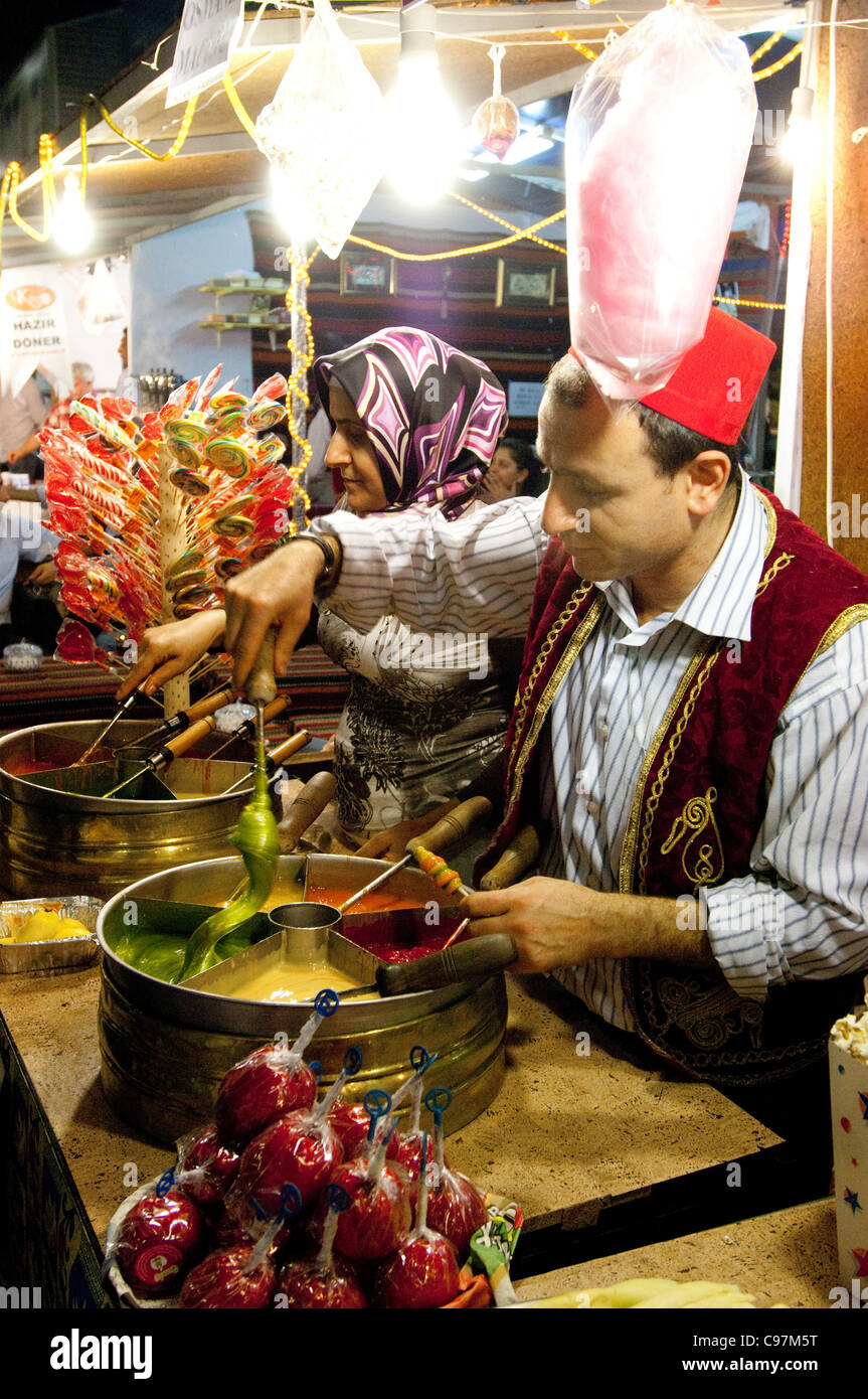 Istanbul Turkey. Man and woman making and selling candy on the ...