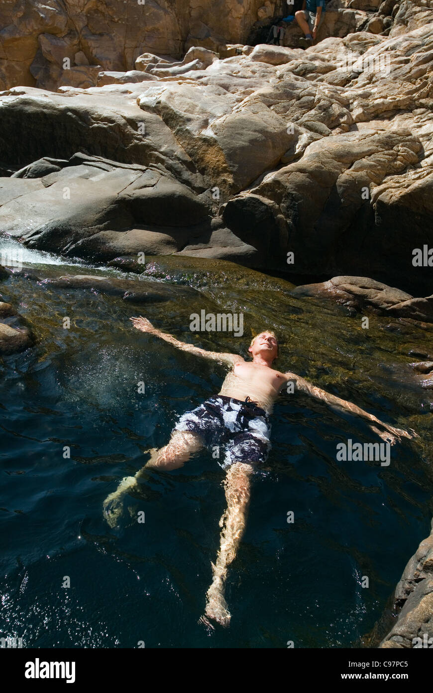 Man swimming in the frestwater pools at Maguk (Barramundi Gorge ...