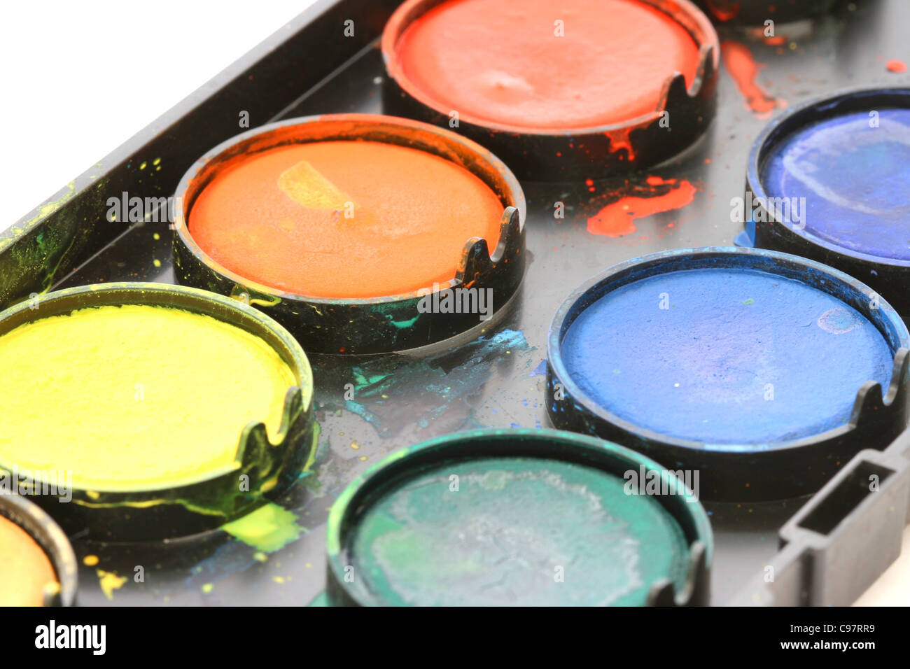 Used water color paint box with a brush close up Stock Photo - Alamy