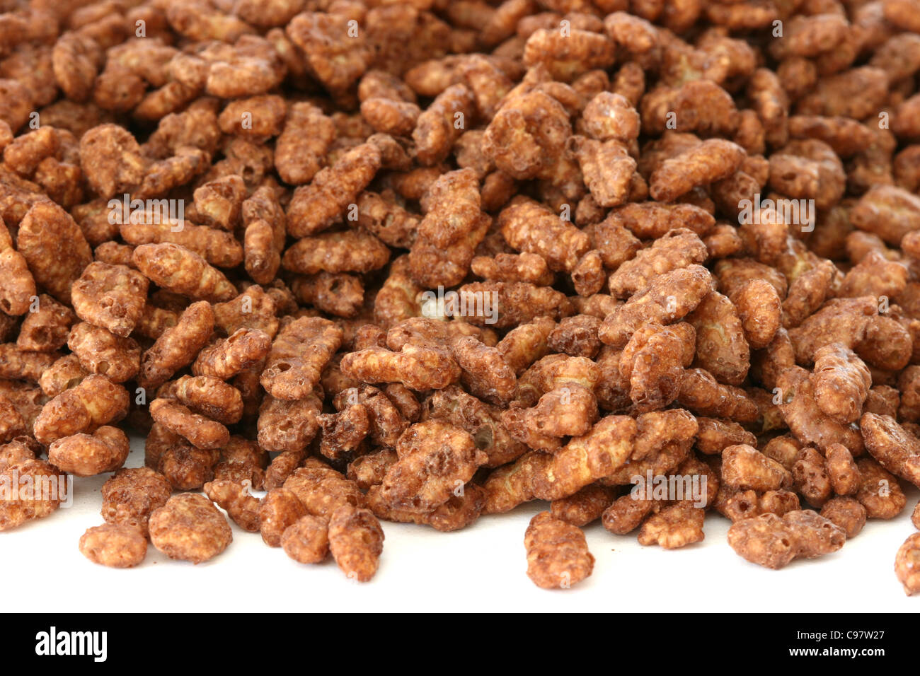 Chocolate popped rice cereals on white background Stock Photo - Alamy