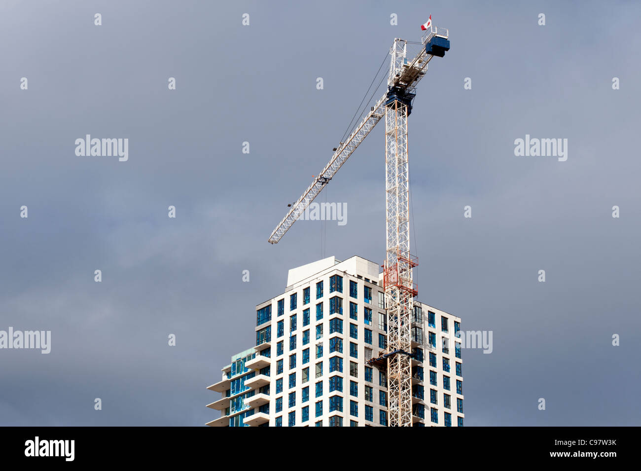 Building in construction and crane Stock Photo - Alamy