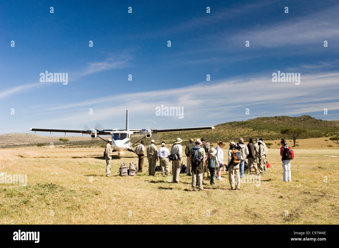 Africa, Tanzania. Katavi. People on safari waiting for bush plane Stock ...