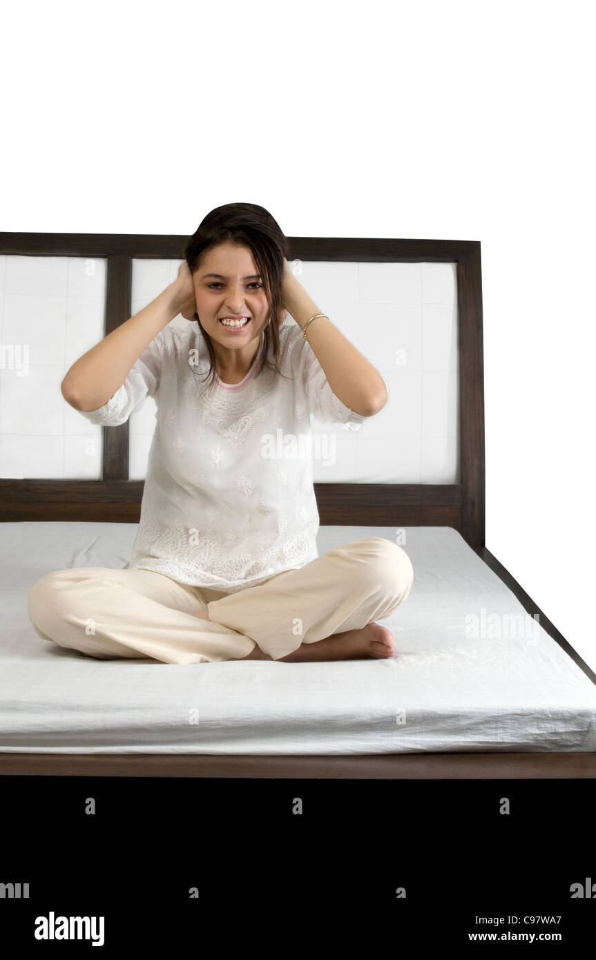 woman shutting her ears Stock Photo - Alamy