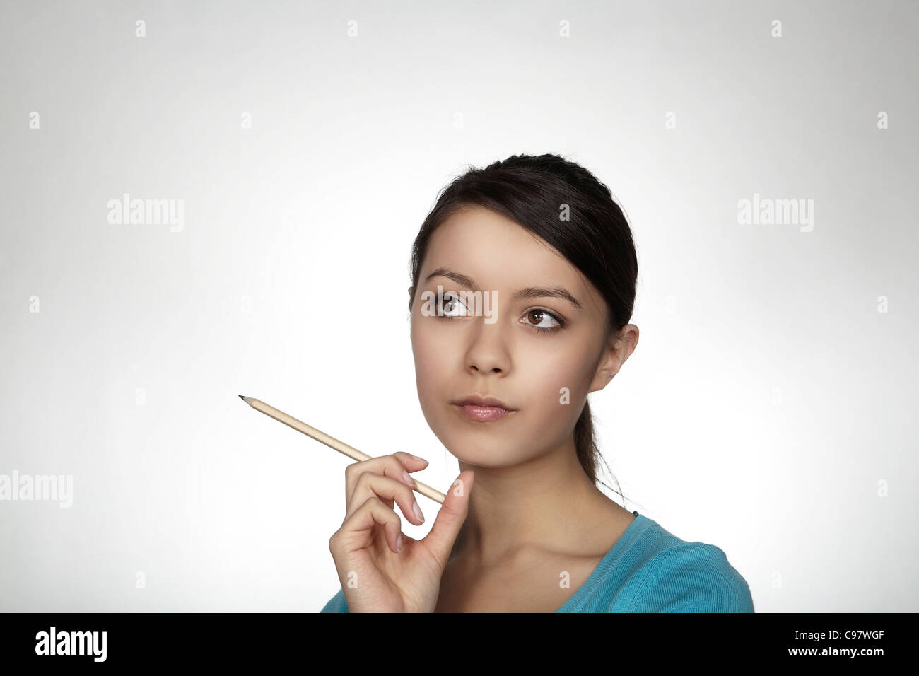 young girl thinking something over Stock Photo - Alamy