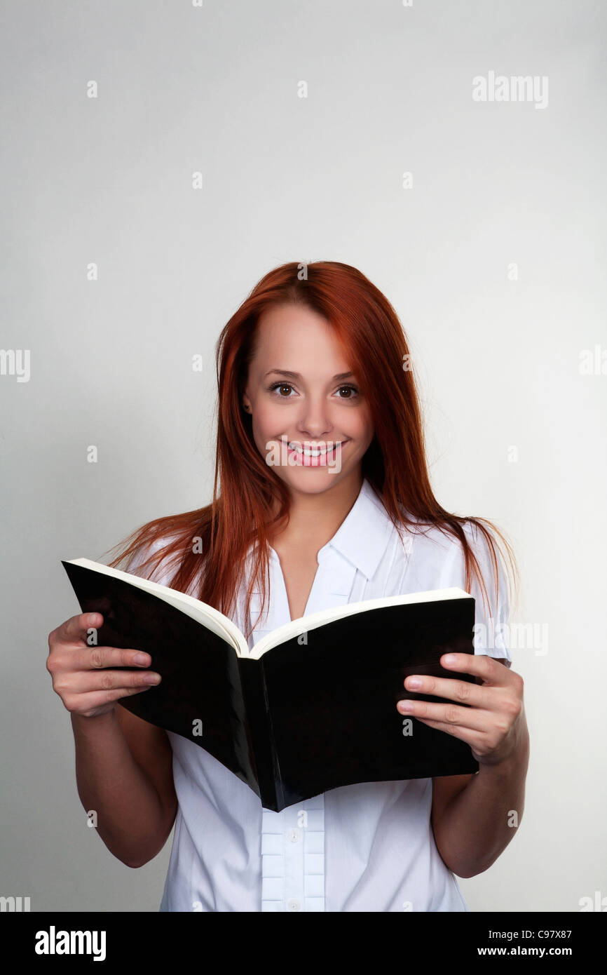 woman reading a large text book Stock Photo - Alamy