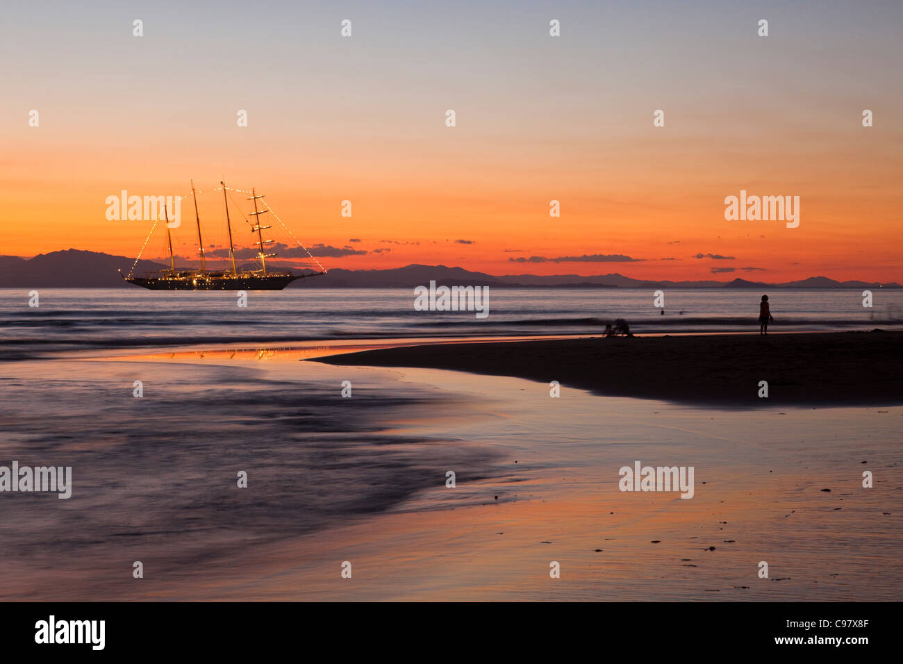 People on beach and sailing cruiseship Star Flyer (Star Clippers ...
