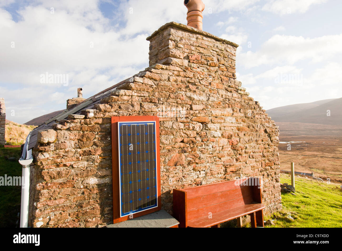 An old croft house with a solar panel at Rackwick on the isle of Hoy ...