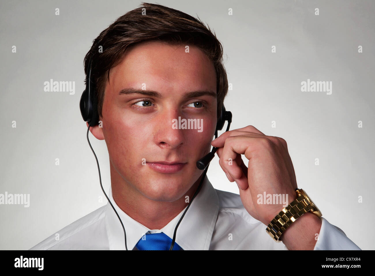 business man in a shirt making a call on the phone wear a head set ...