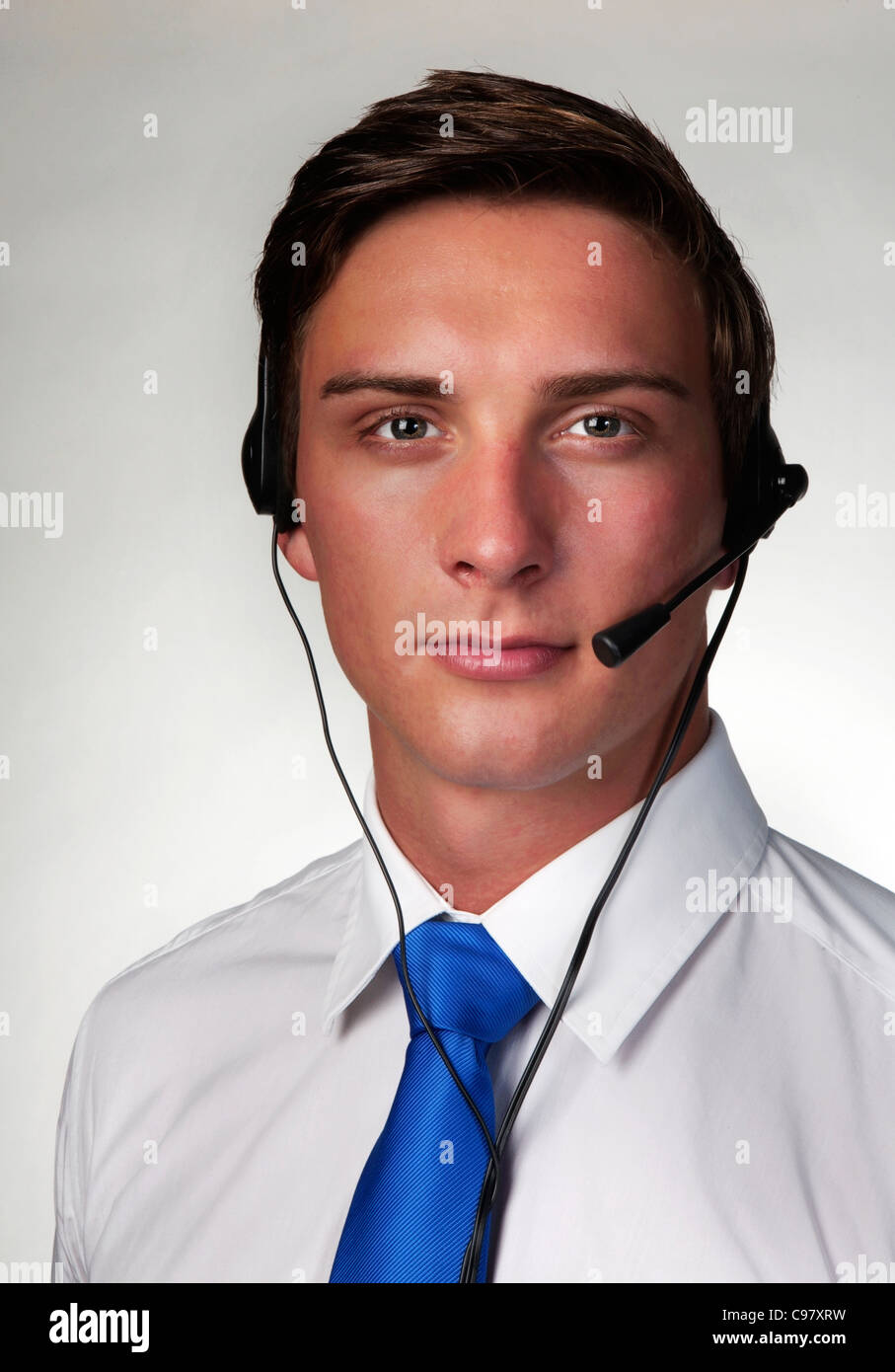 business man in a shirt making a call on the phone wear a head set ...