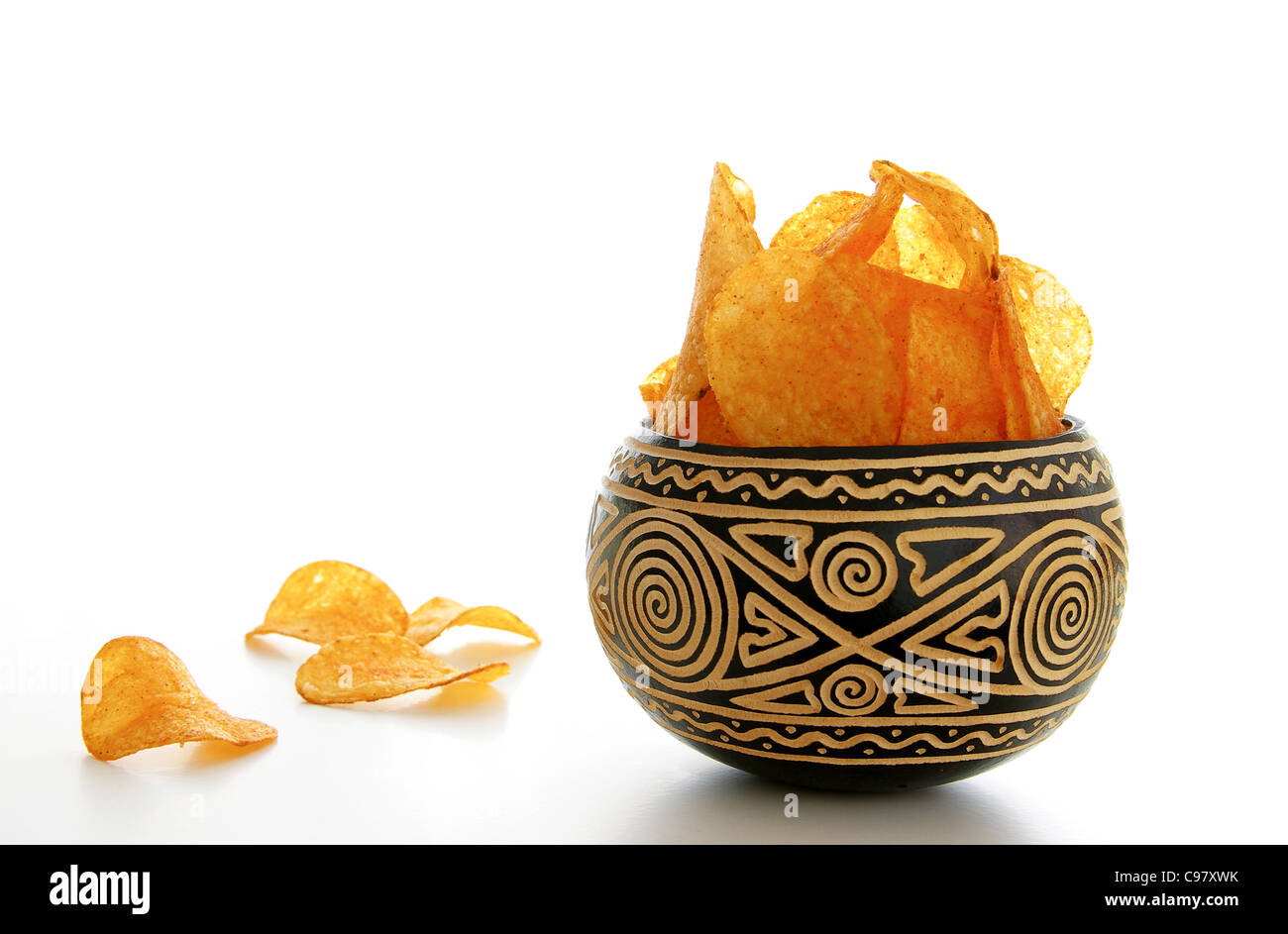 A carved bowl full of chips Stock Photo - Alamy