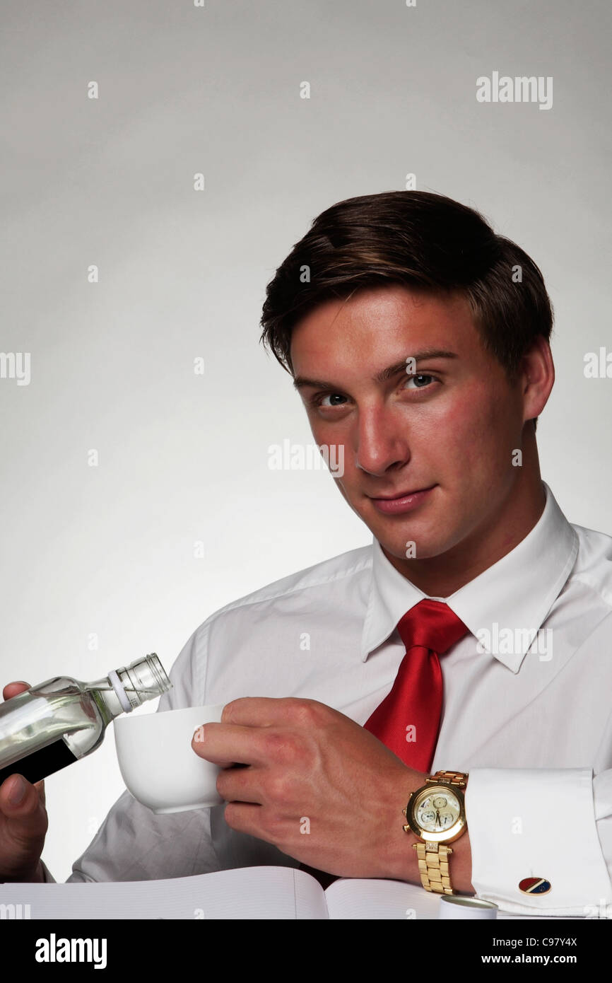businessman having a drink at work Stock Photo - Alamy