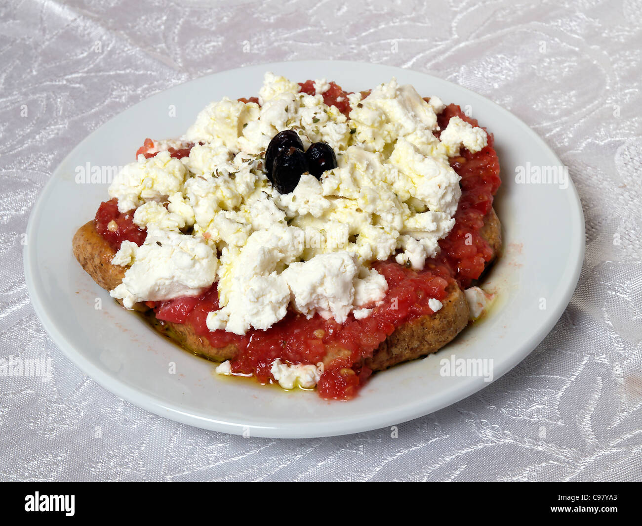 ''Dakos'' kretan cretan Greek salad plate by the seaside. aeegean ocean ...
