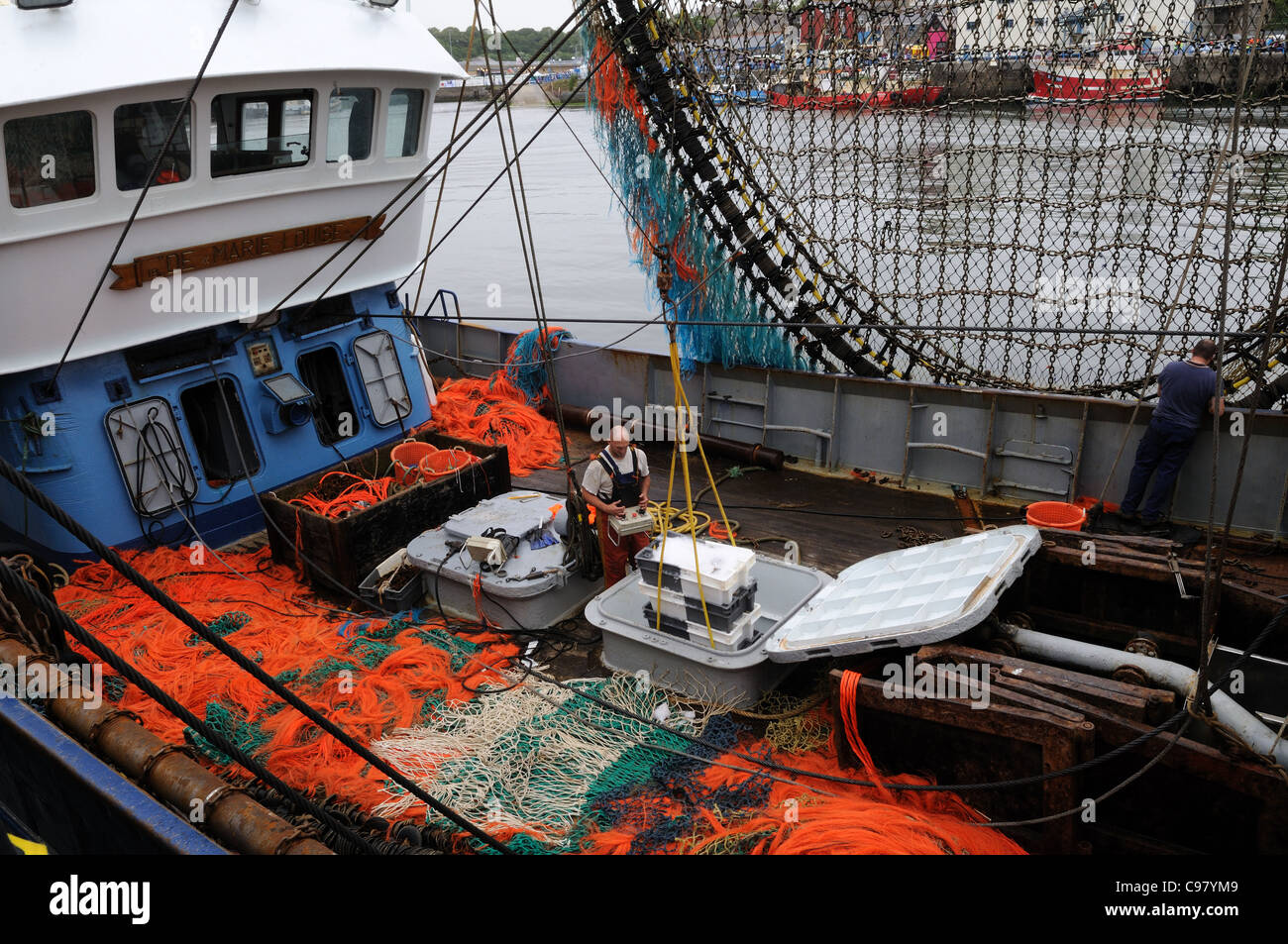 Men working on a commercial fishing trawler Milford Haven Port Nelson ...