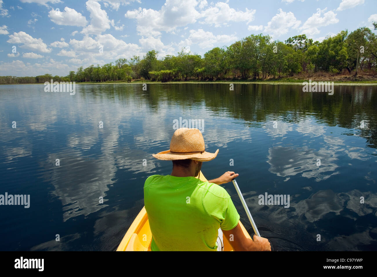 Man canoeing on Annaburroo Billabong, near Kakadu National Park ...