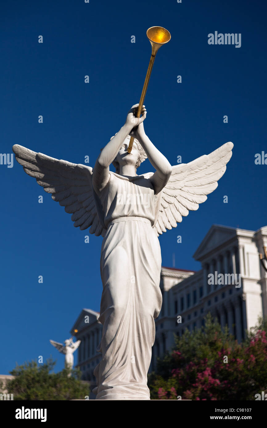 Angel playing golden bugle Stock Photo - Alamy