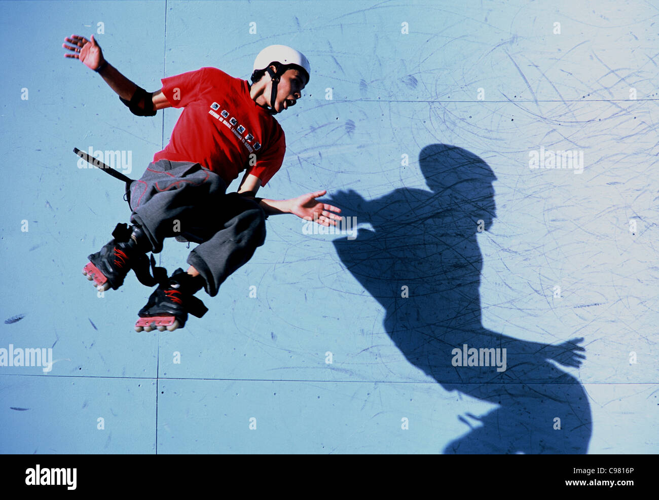 Inline skater flying up a ramp in Riverside Park in New York City Stock ...
