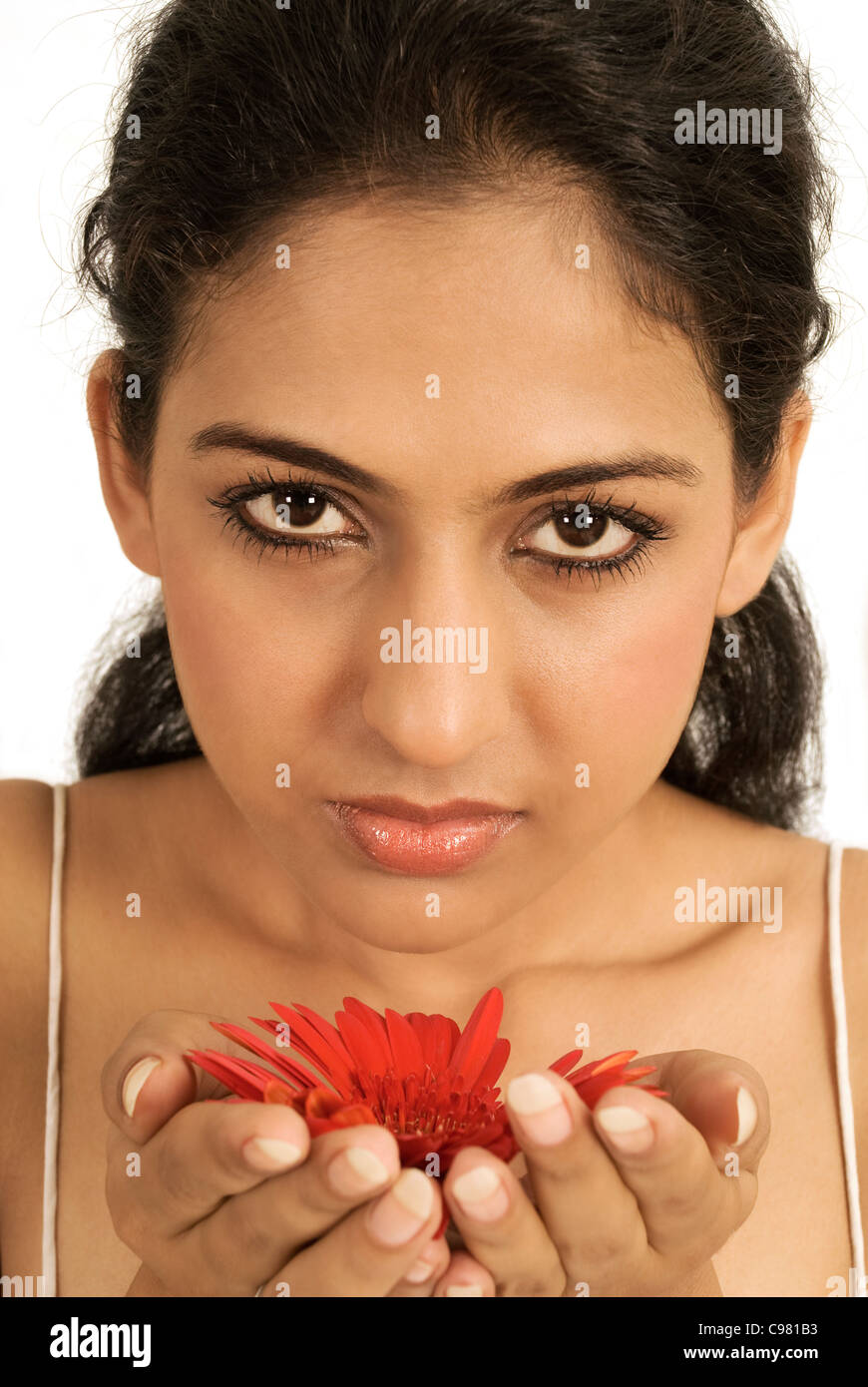 girl with a flower in her hand Stock Photo - Alamy