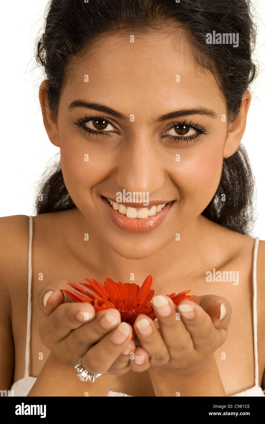 girl with a flower in her hand Stock Photo - Alamy