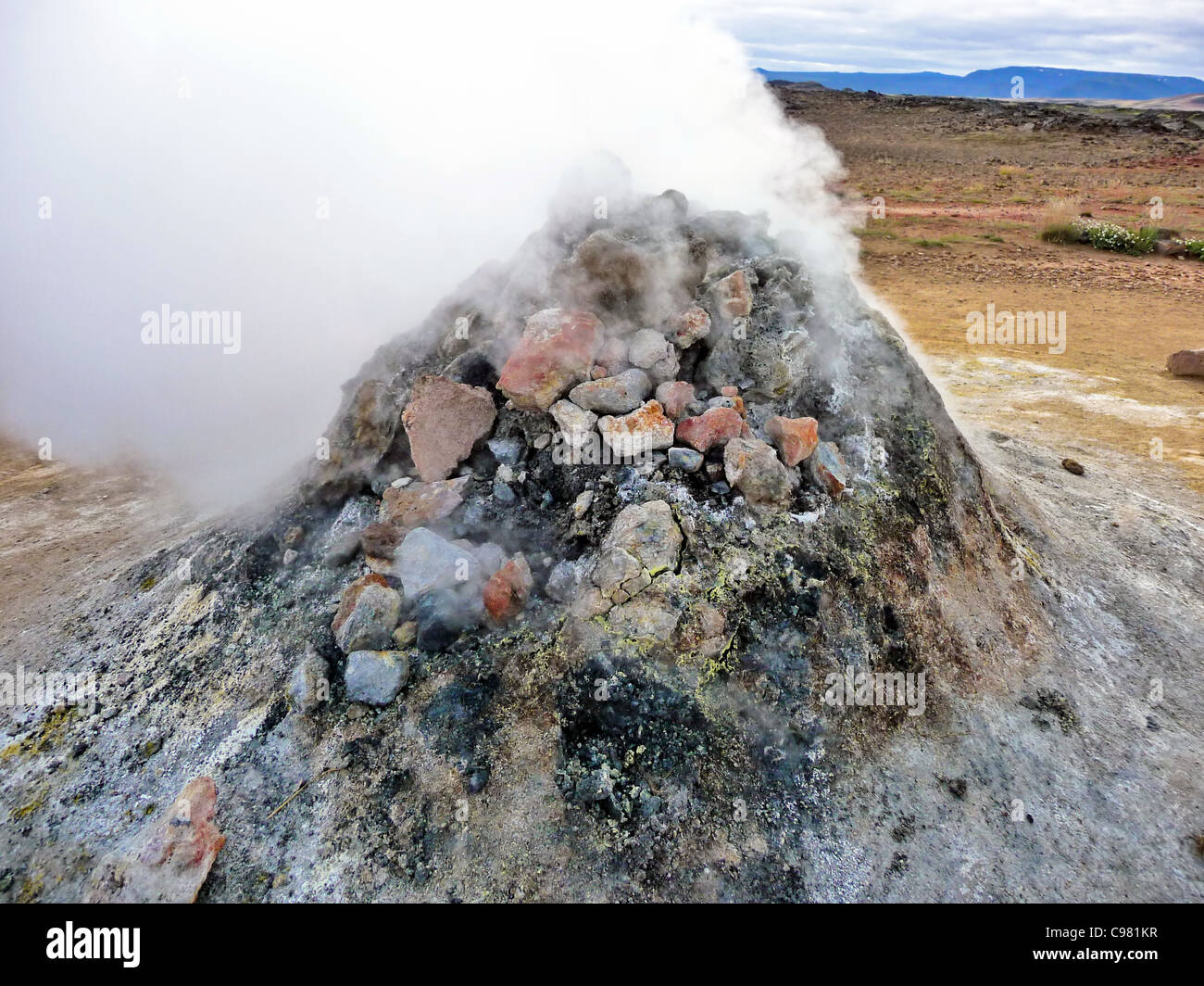Rock pile geothermal fumarole in iceland in summer time Stock Photo - Alamy