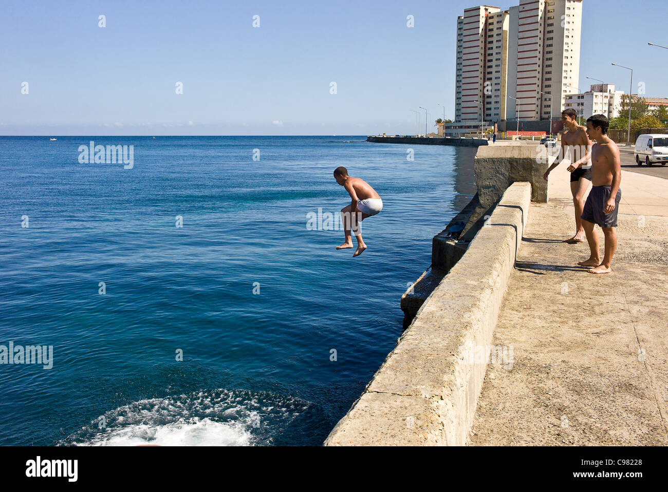 Teen boys swimming along the "Malecon" in Havana, Cuba Stock Photo - Alamy