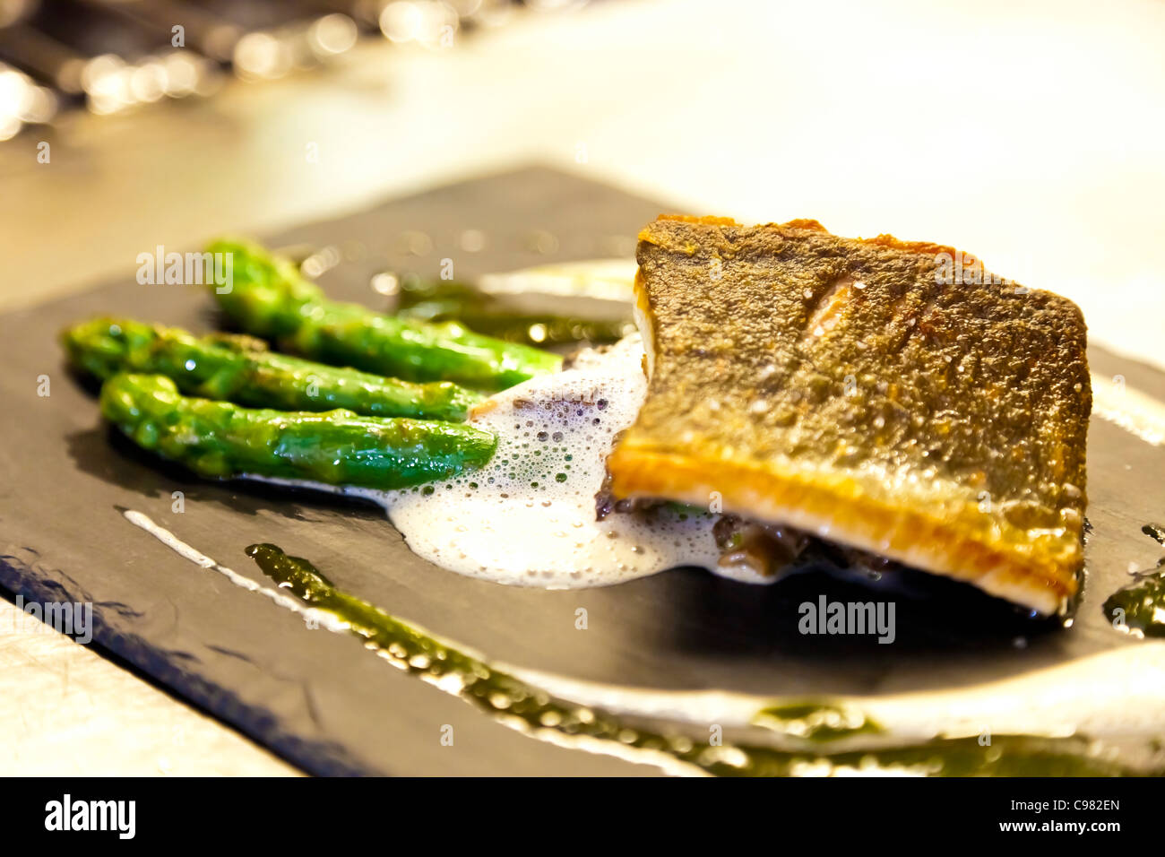 Slice of fish, asparagus and morels with a special sauce., Restaurant ...